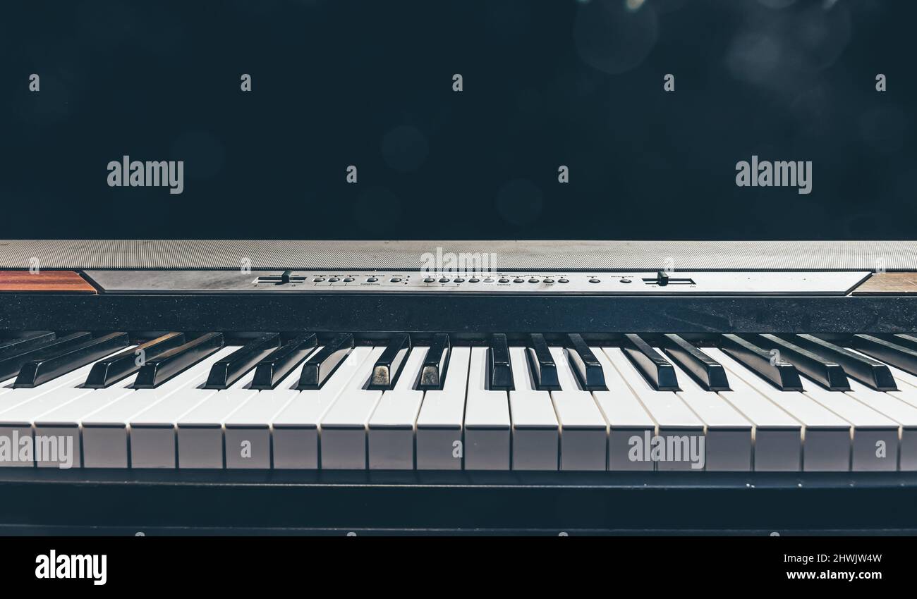 Piano keys isolated in the dark, copy space Stock Photo - Alamy