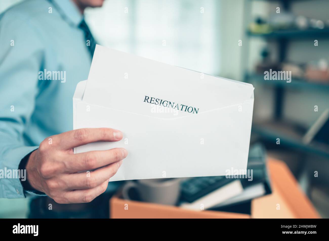 Businessman sending and showing resignation letter to employer boss ...