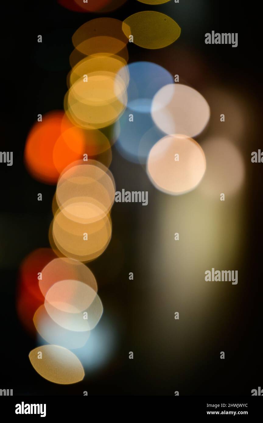 Abstract twinkling lights background with bokeh defocused multicolored ...