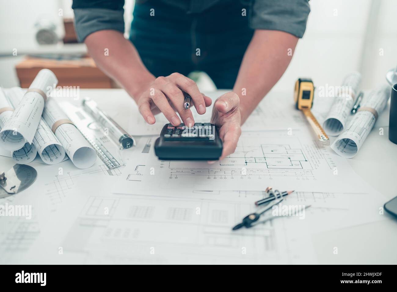Architect engineer use calculator for calculate drawing design working ... Architect engineer use calculator for calculate drawing design working ...