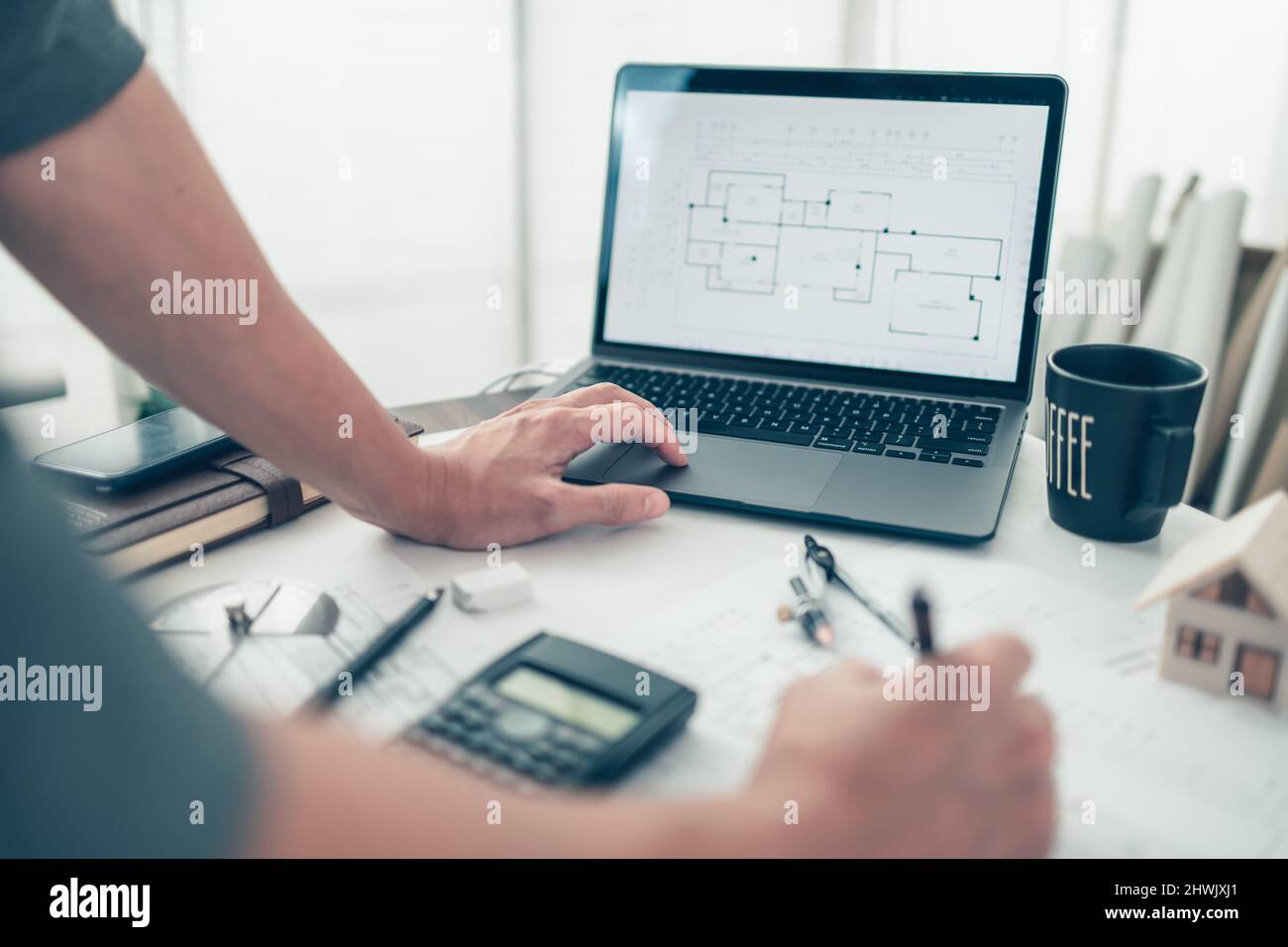 Architect engineer use laptop for check drawing design. House planning ...