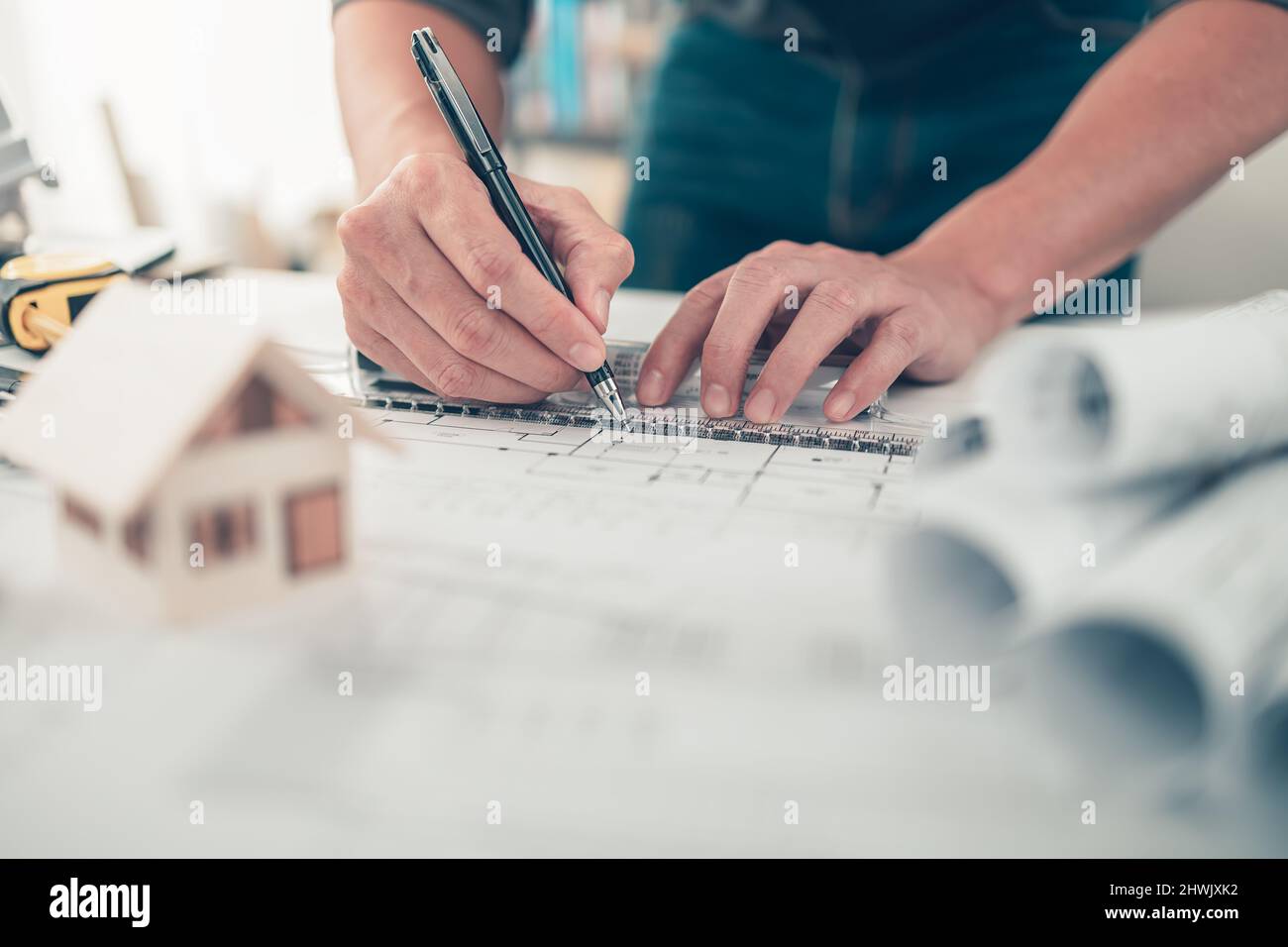 Architect engineer use pen and angle protector drawing design working ...