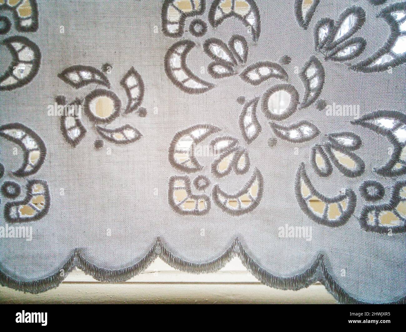 White curtains with retro embroidery on the window Stock Photo - Alamy