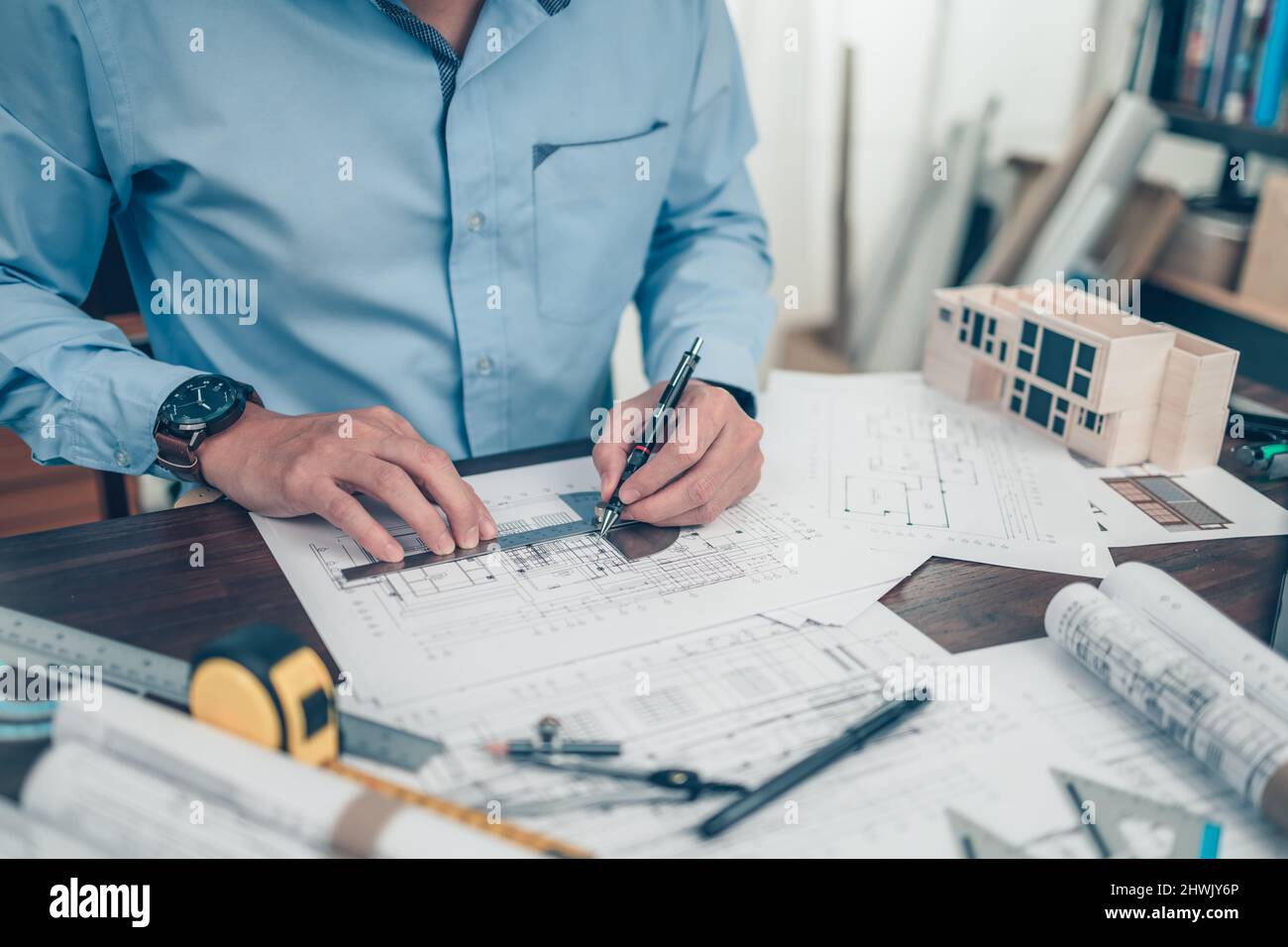 Architect engineer use pen and angle protector drawing design working ...