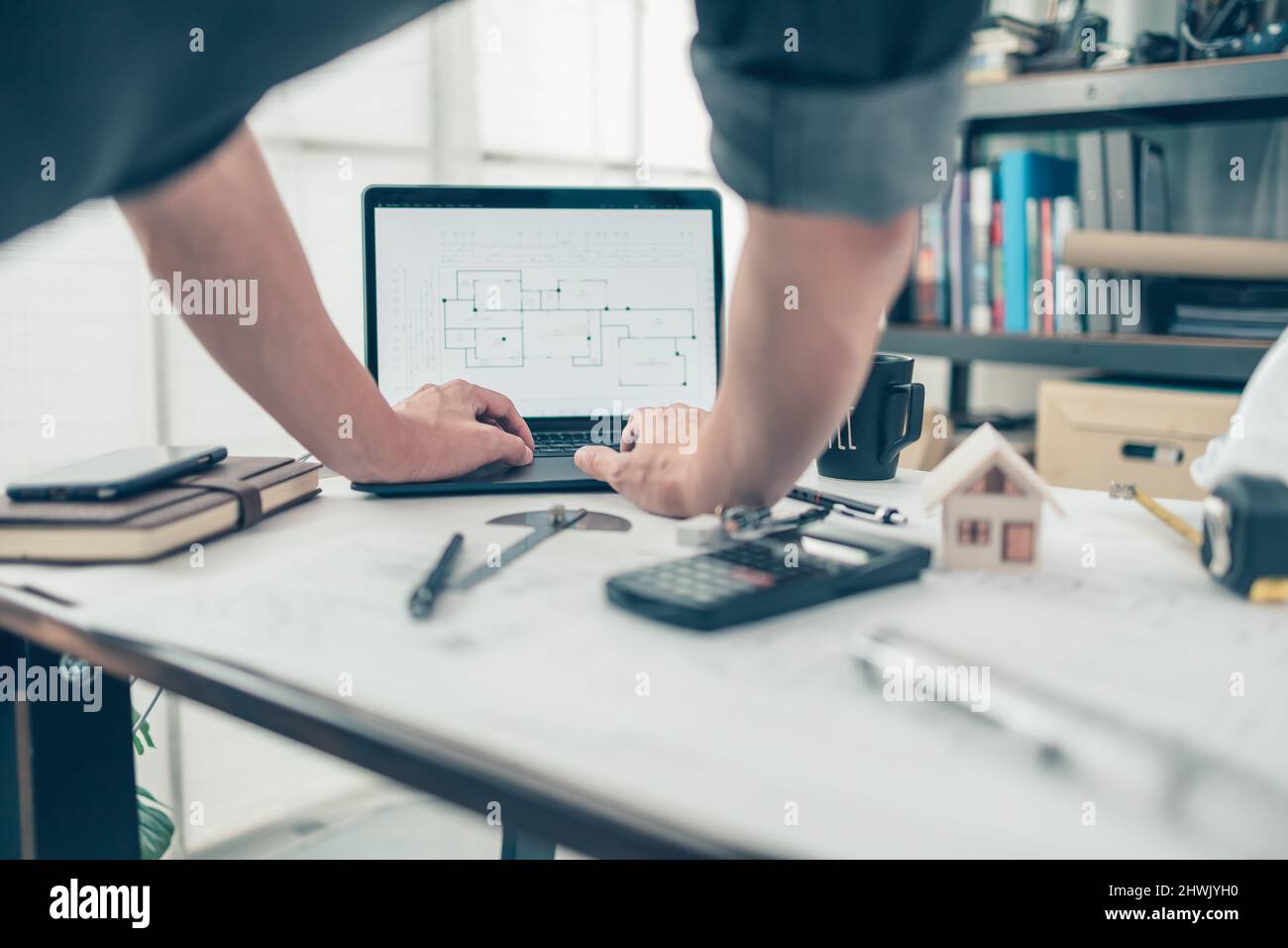 Architect engineer use laptop for check drawing design. House planning ...