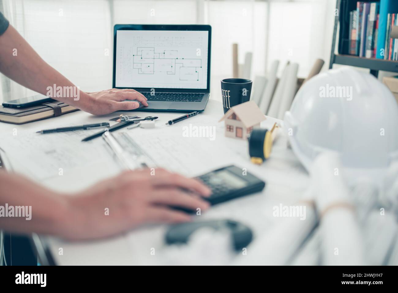 Architect engineer use laptop for check drawing design. House planning ...