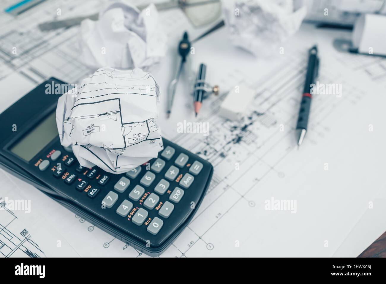 paper crumbs on calculator, eraser crumbs, compass and pencil on ...