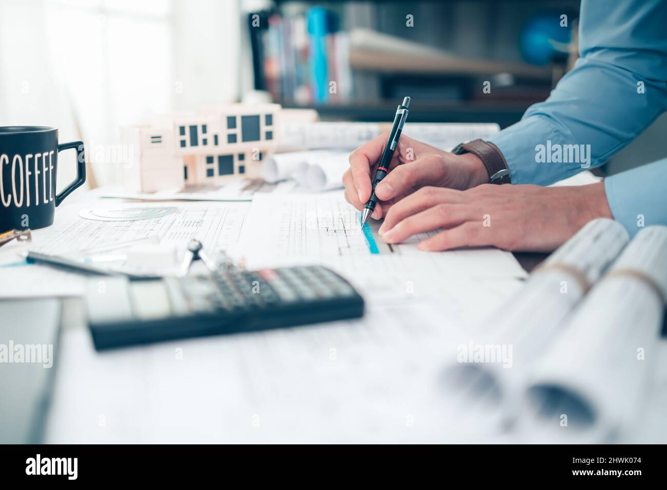 Architect engineer use pen and angle protector drawing design working ...