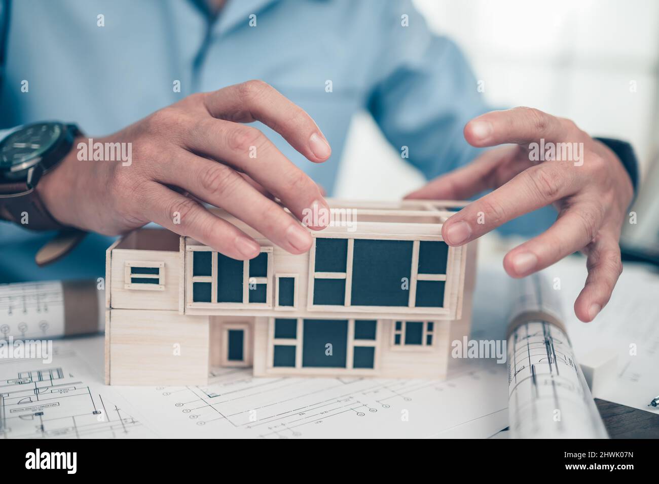 Architect engineer design house model on bueprint. House planning ...