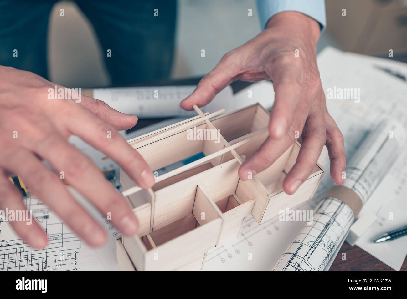 Architect engineer design house model on bueprint. House planning ...