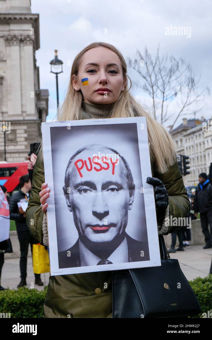 London, England. 06 March 2022. A young Ukrainian women with a photo of ...