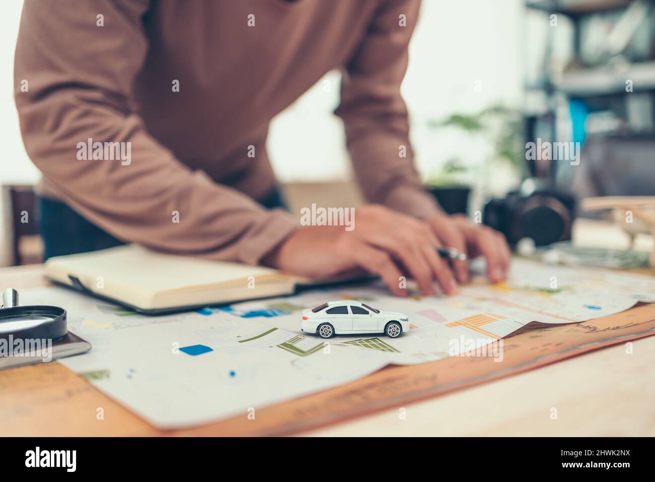 model car on road map and tourist planning before traveling in vocation ...