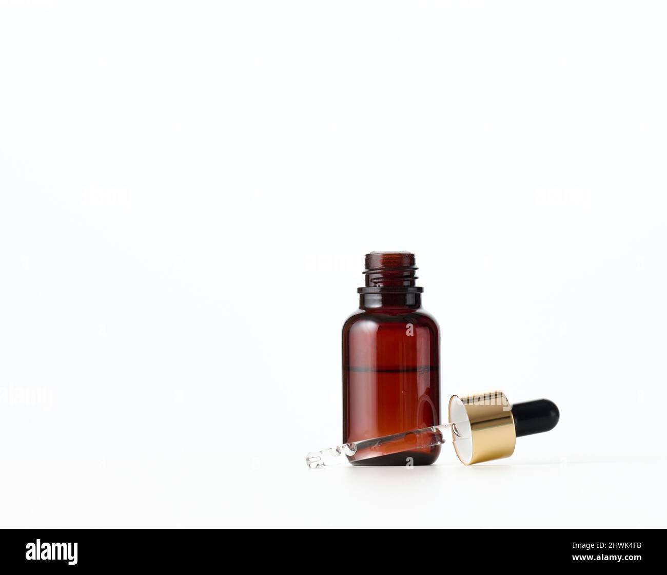 brown glass bottle with a pipette. Container for cosmetics, acids and ...