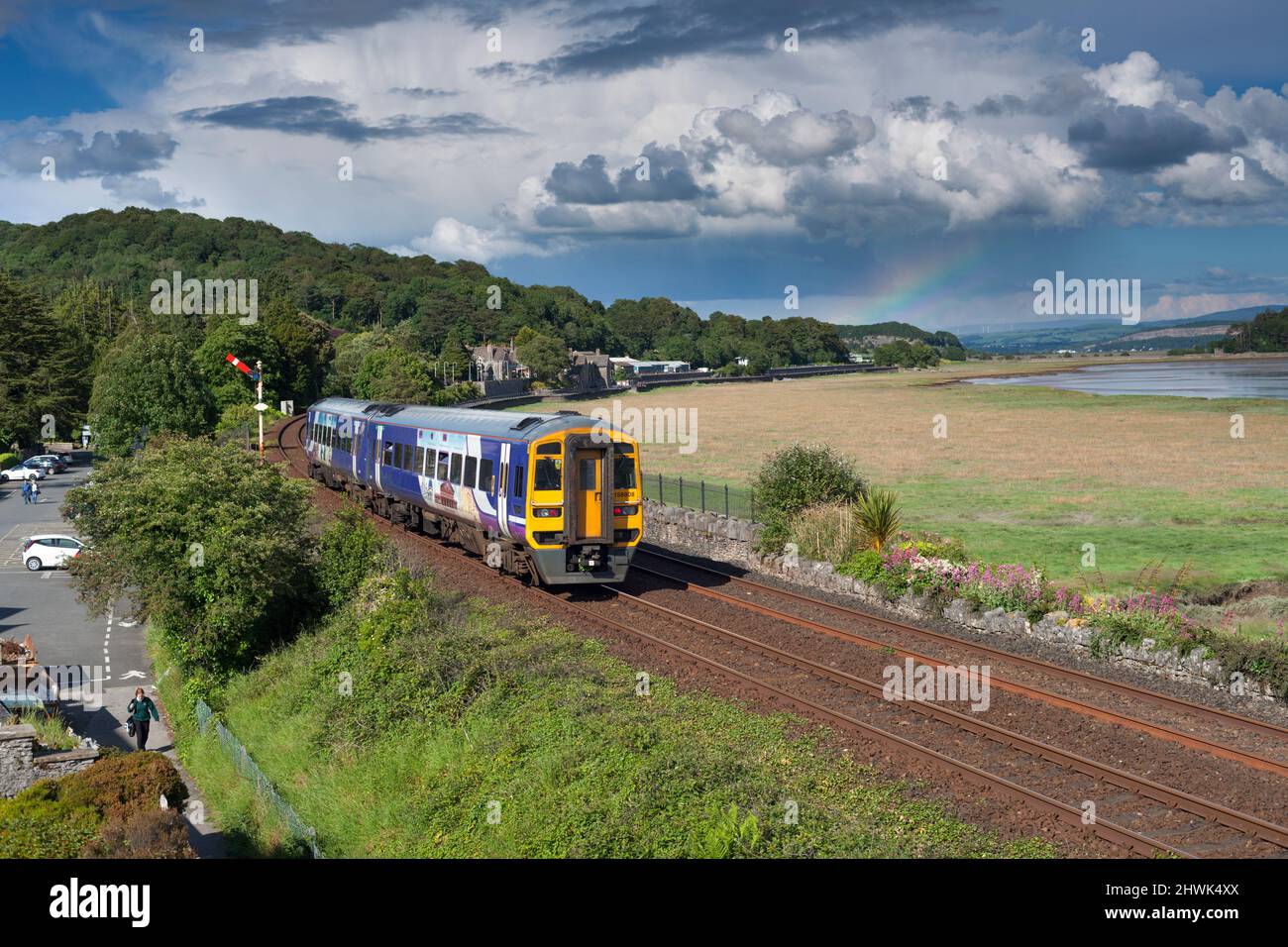 Northern rail class 158 sprinter train 158908 at Grange Over Sands, south Cumbria passing a ...