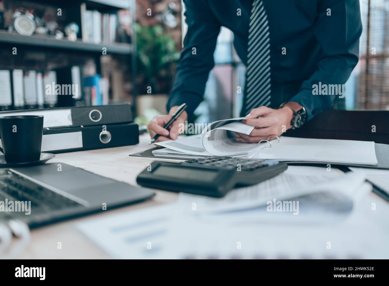 accounting reading report from file folder and financial statement on ...