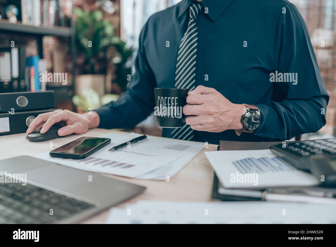 Accountant drink coffee and working on company data, document and ...