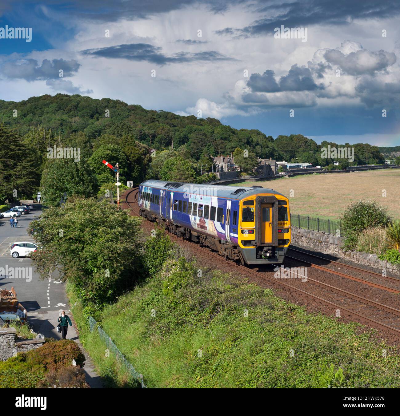Northern rail class 158 sprinter train 158908 at Grange Over Sands, south Cumbria passing a ...