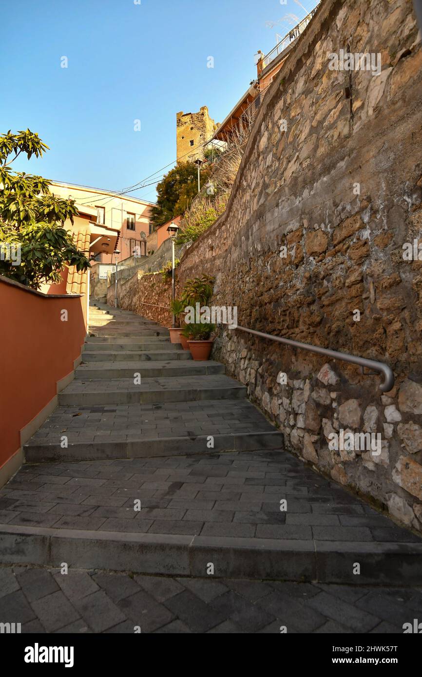 A narrow street among the old stone houses of Sarno, town in Salerno ...