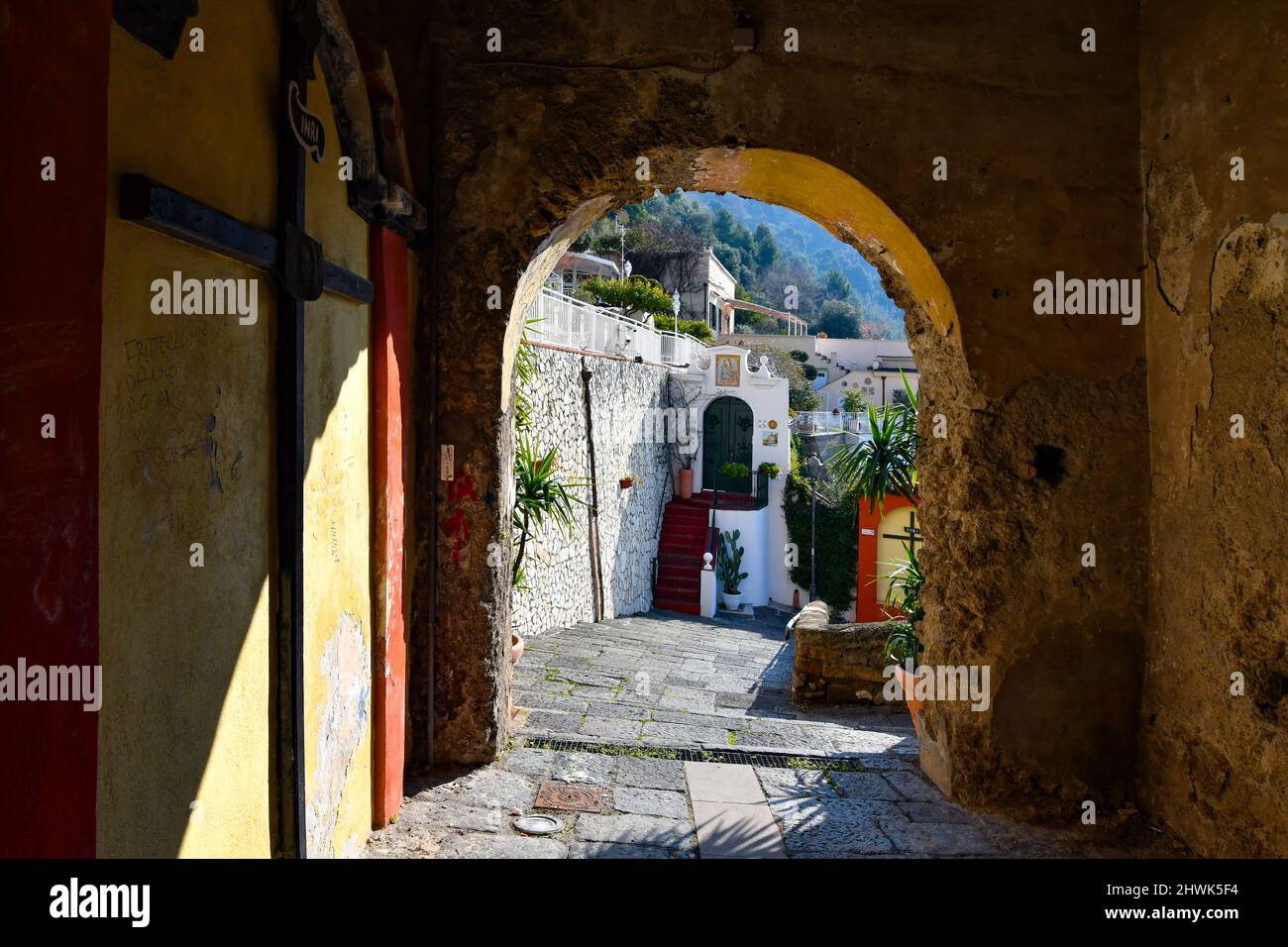 A narrow street among the old stone houses of Sarno, town in Salerno ...