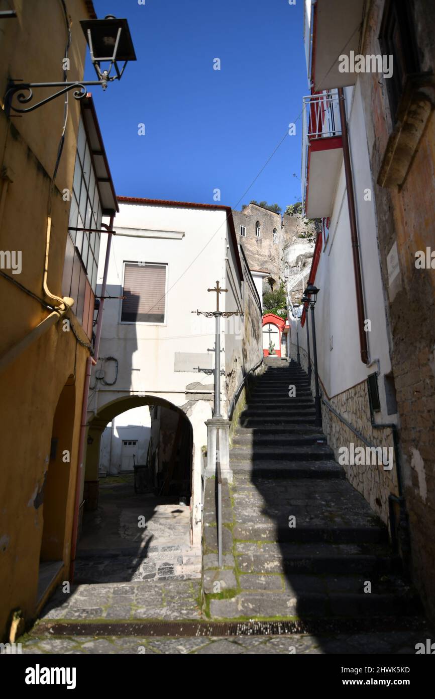 A narrow street among the old stone houses of Sarno, town in Salerno ...