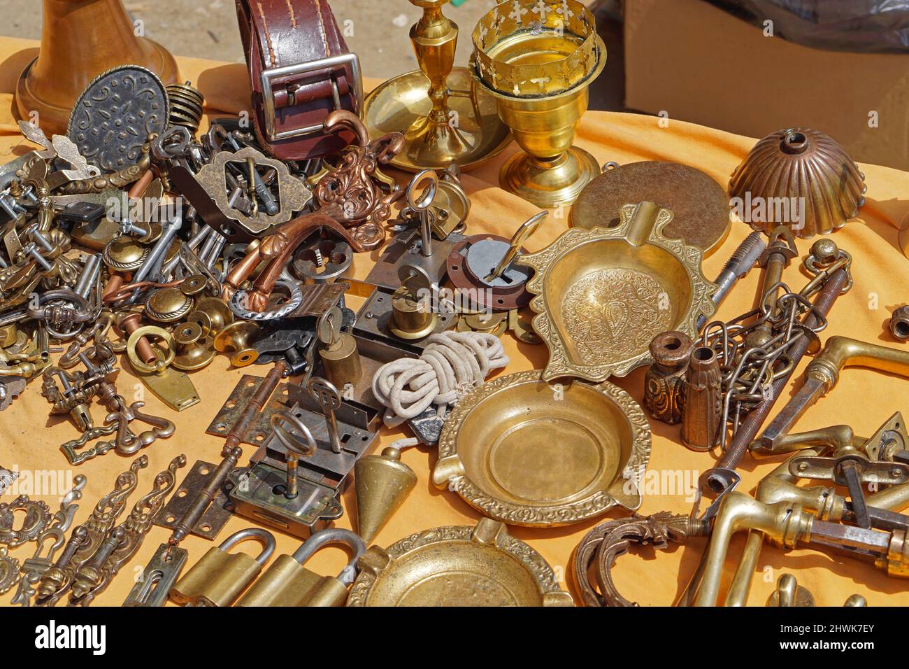 Antique brass and bronze objects for sale at flea market Stock Photo ...