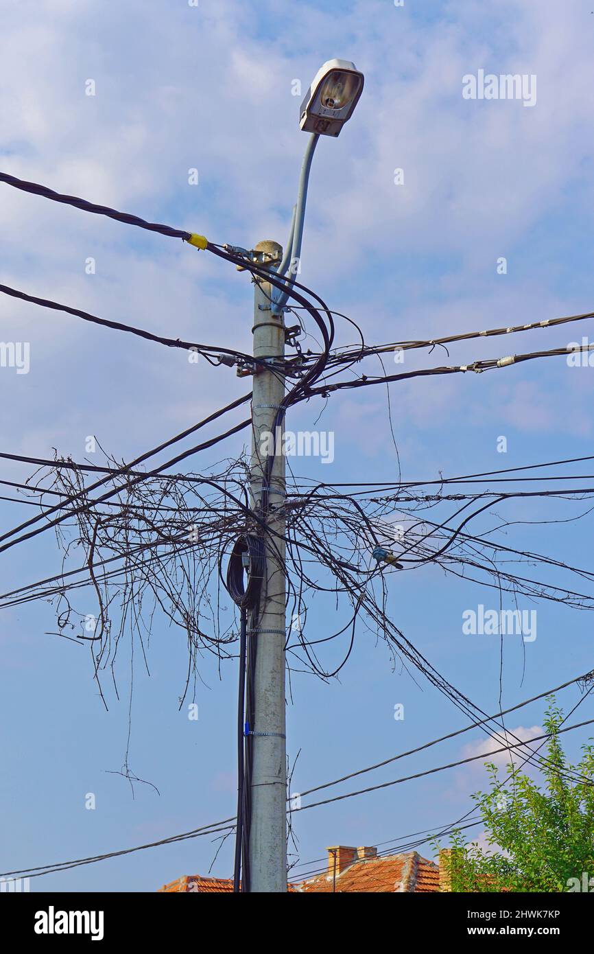 Utility pole with bunch of electric wires and cables mess danger Stock ...