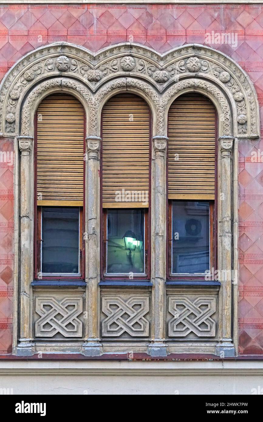 Three arches windows at classic style building with red facade Stock ...
