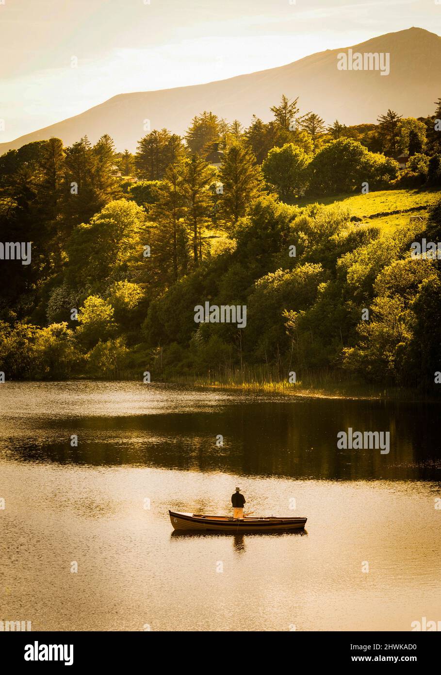 One man fishing on Creeslough lake,County Donegal, Ireland below ...