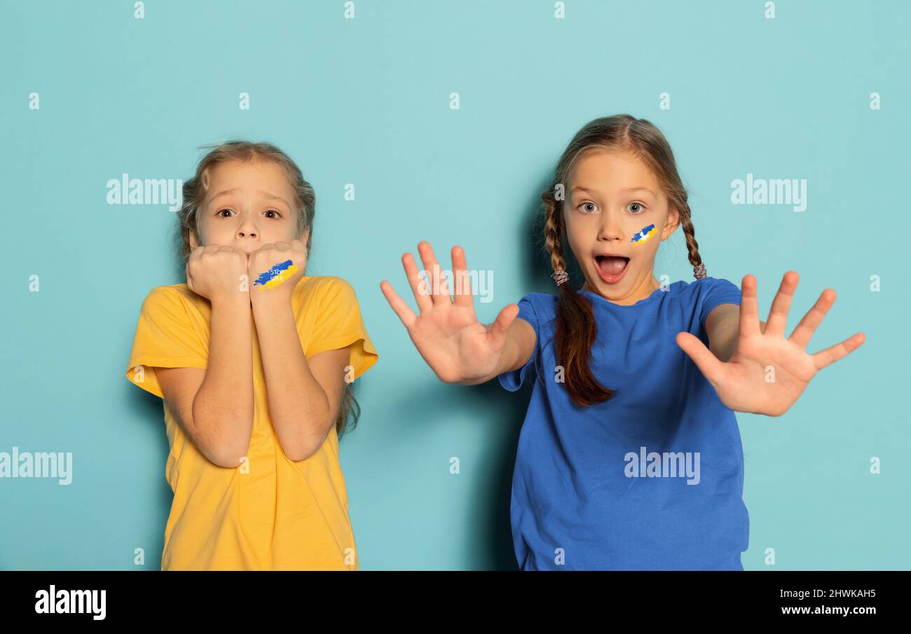 Conceptual portrait with scared little girls, kids shouting isolated on ...