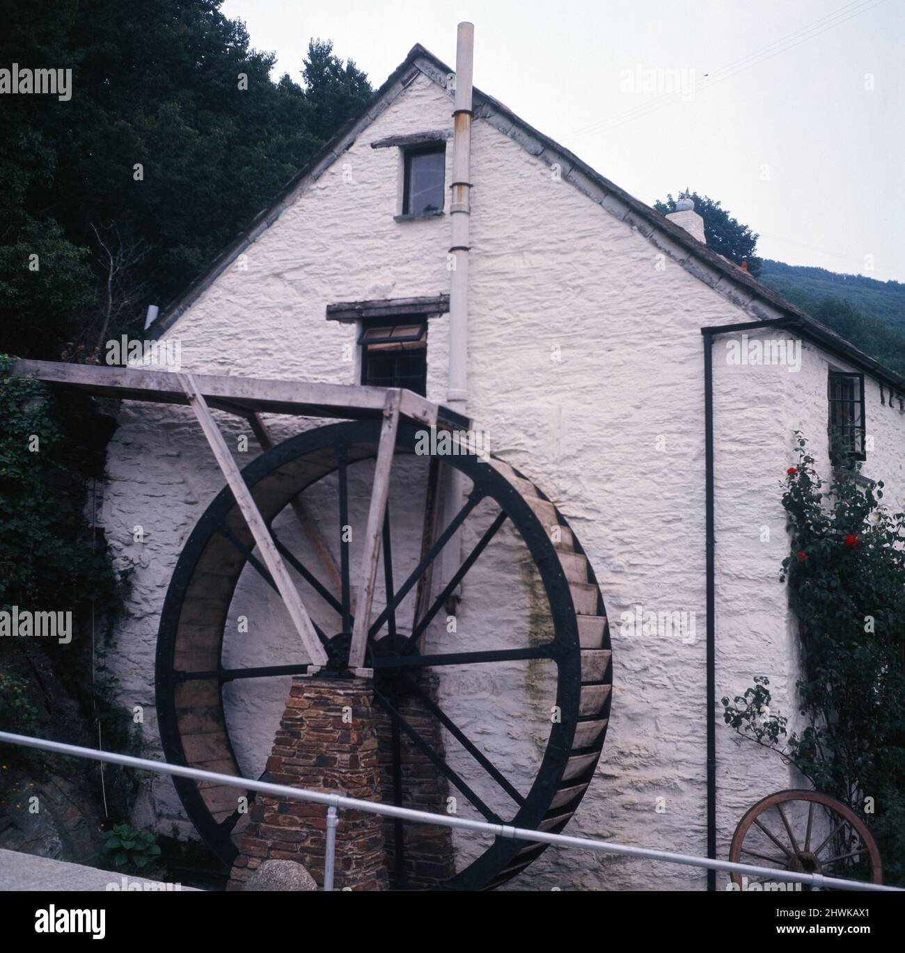 A water wheel on a house in Polperro, Cornwall. 1973 Stock Photo - Alamy