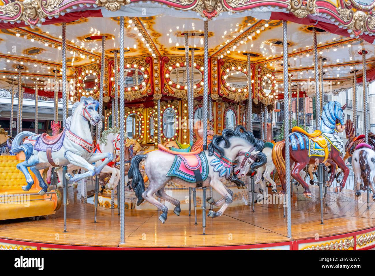 Horse carousel attraction at the fair on festival days Stock Photo - Alamy