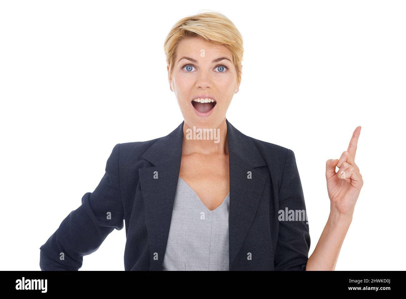 Pointing up in shock. Portrait of a young businesswoman pointing ...