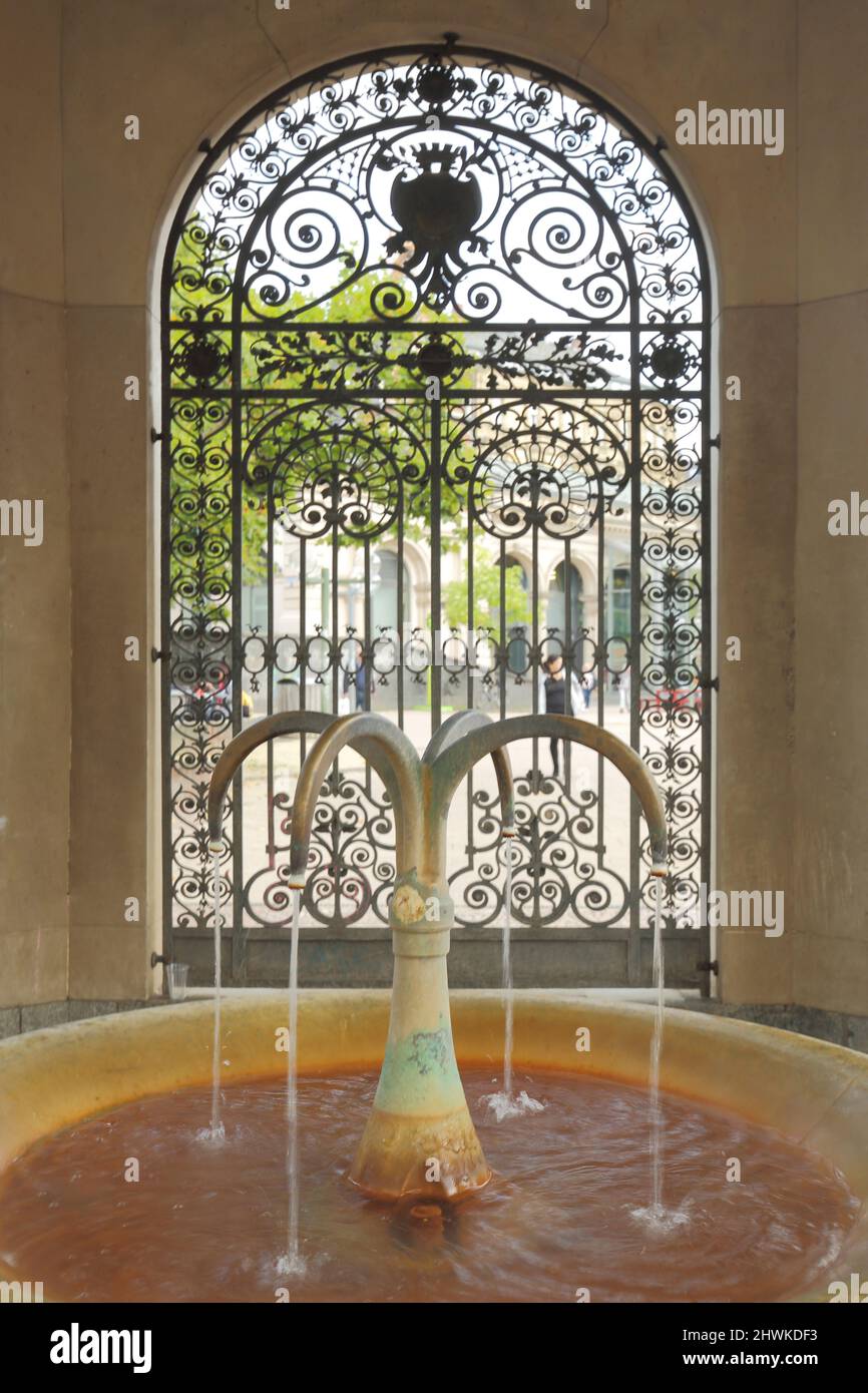 Sodium chloride hot spring, cooking fountain with ornate metal grating ...