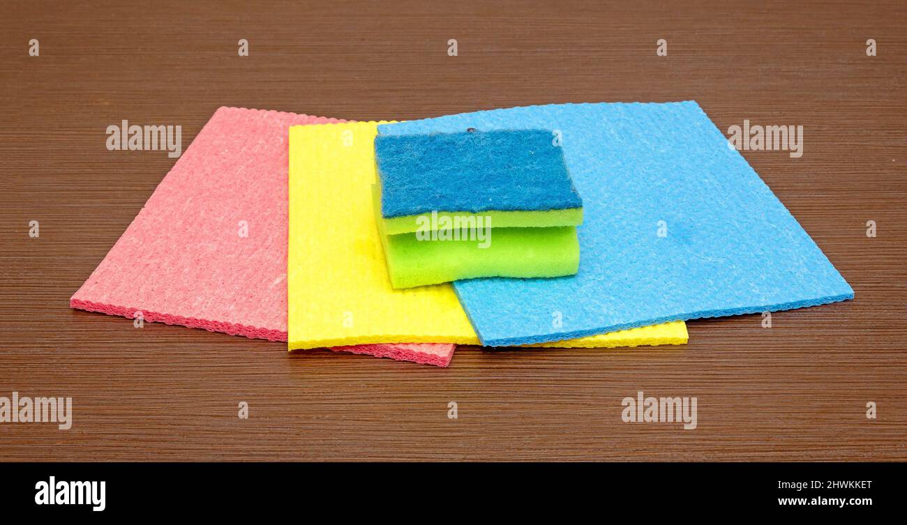 Kitchen cleaning tools and utensils on wood table used in households ...