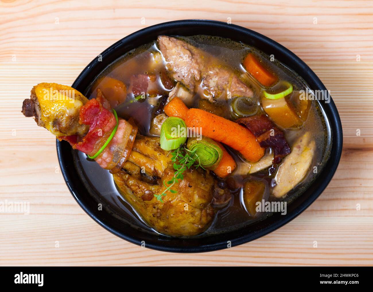 Thick chiken soup with smoked bacon Stock Photo - Alamy