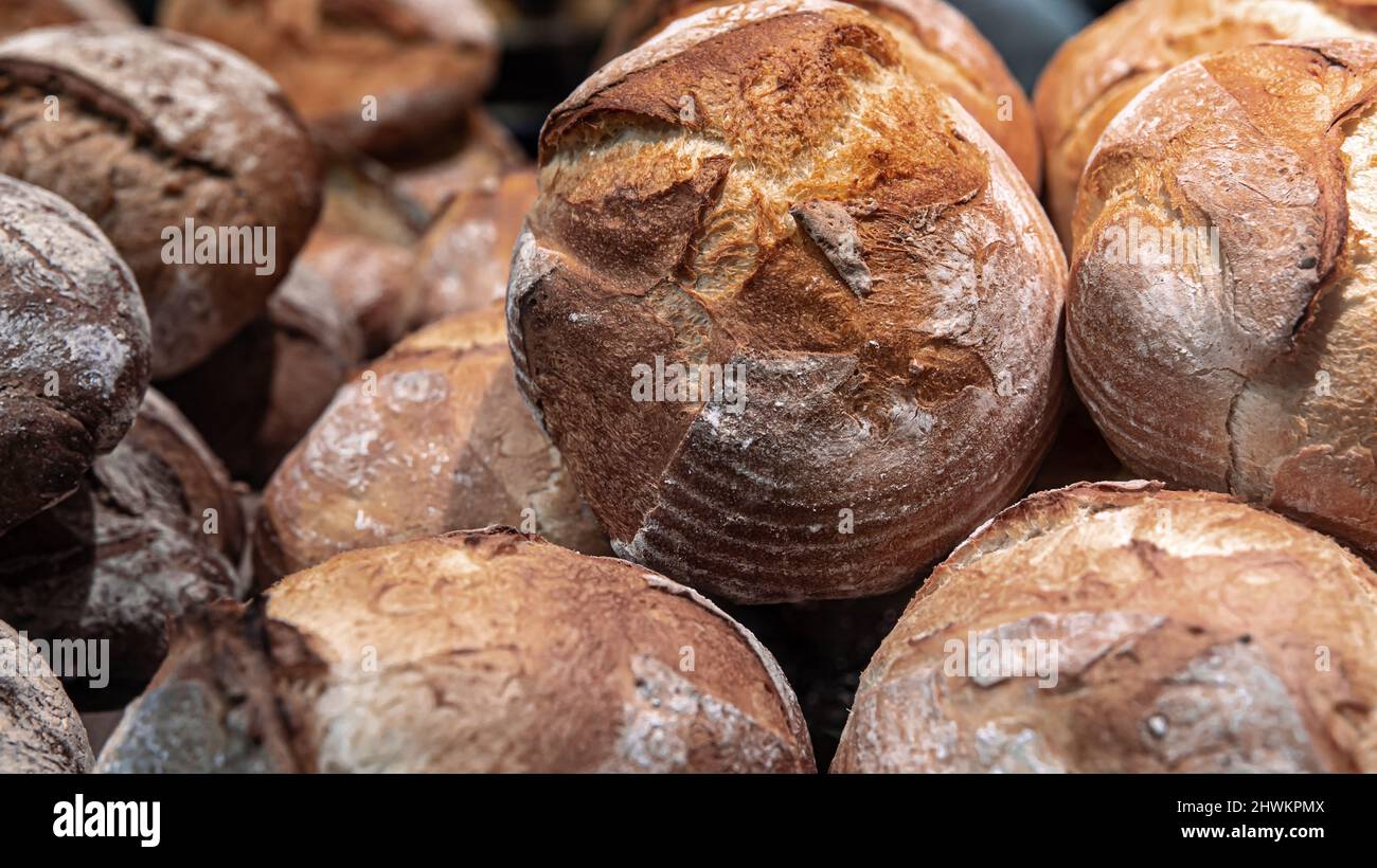 Large loaves of bread on the counter of a bakery Stock Photo - Alamy