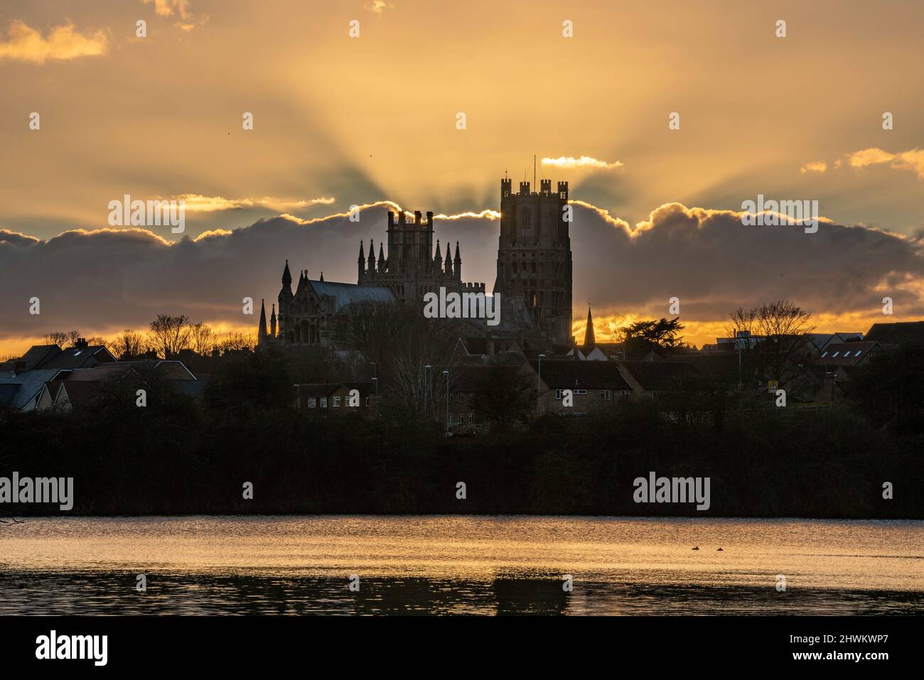 Sunset behind Ely Cathedral, as seen from Roswell Pits Nature reserve ...
