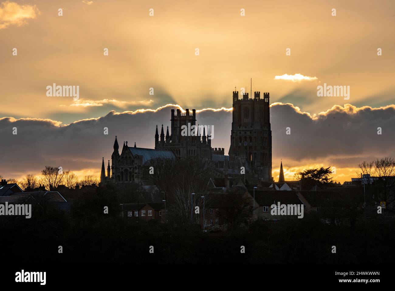 Sunset behind Ely Cathedral, as seen from Roswell Pits Nature reserve ...