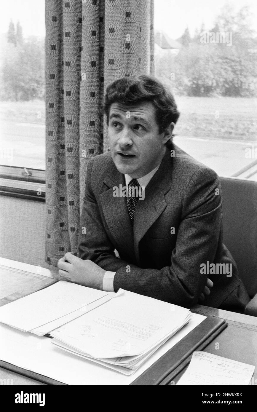 Geoffrey Robinson, Managing Director Jaguar Cars, pictured at his desk ...