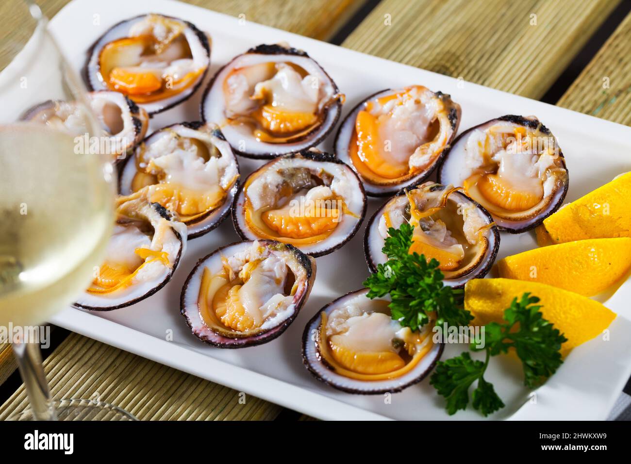 Fresh bivalve mussels with lemon Stock Photo - Alamy