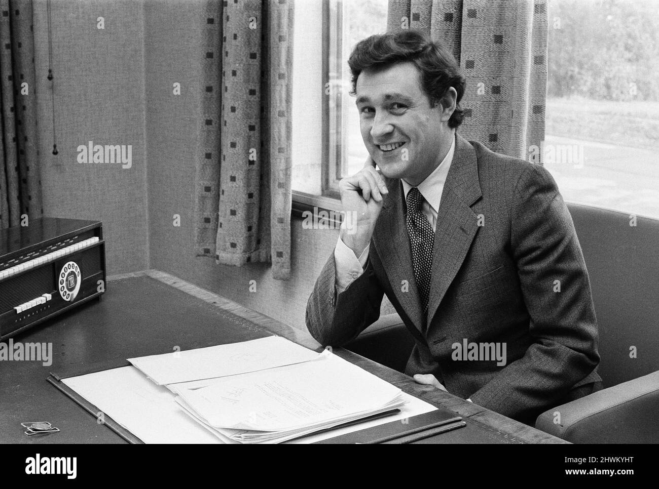 Geoffrey Robinson, Managing Director Jaguar Cars, pictured at his desk ...