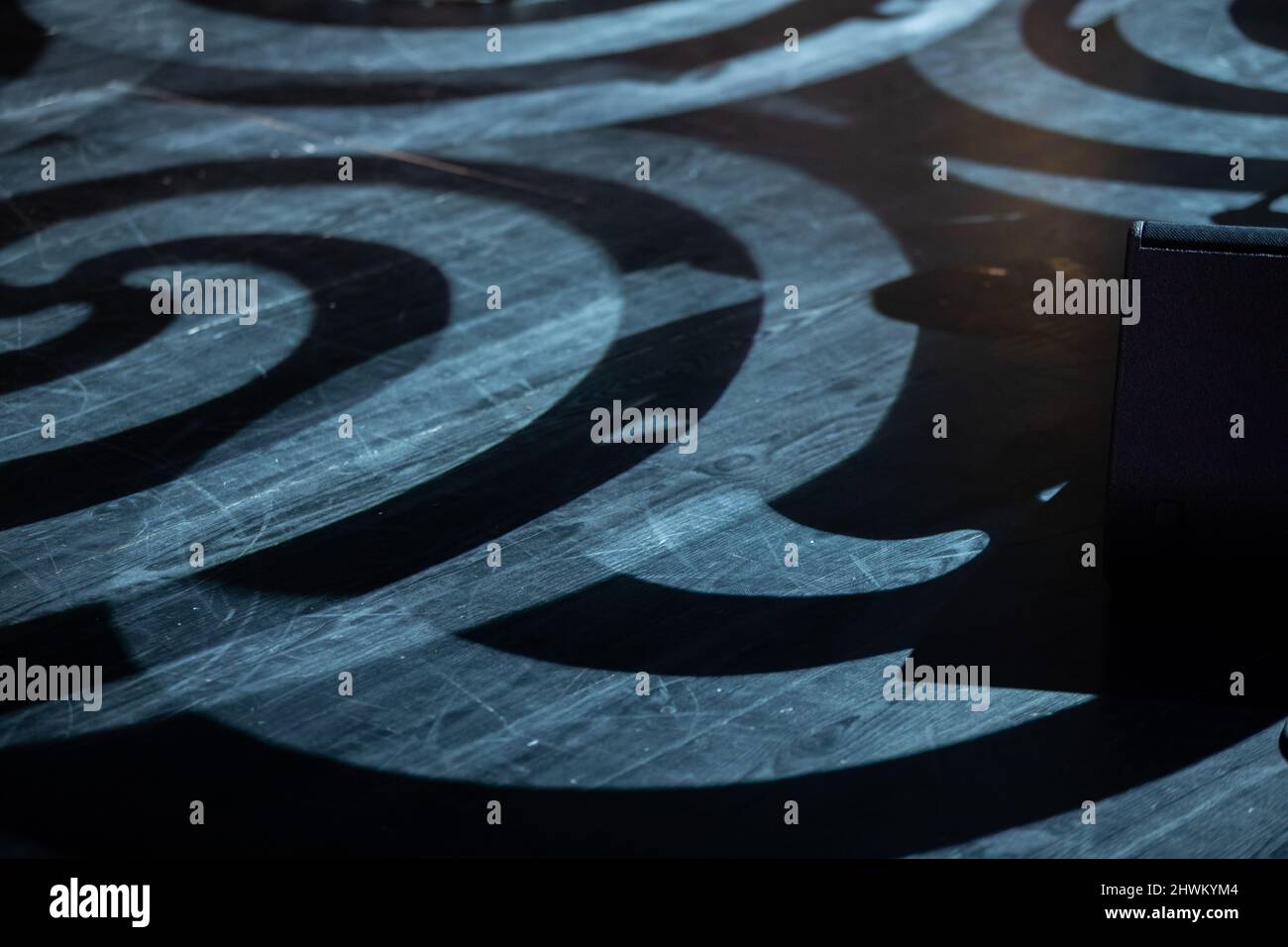 Lighting effects on the floor from stage lighting at a music concert ...