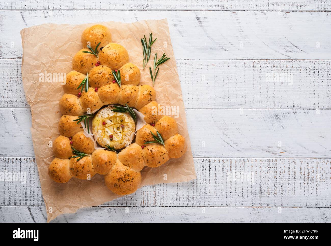 Bread buns Christmas tree with Roasted camembert cheese and rosemary on ...