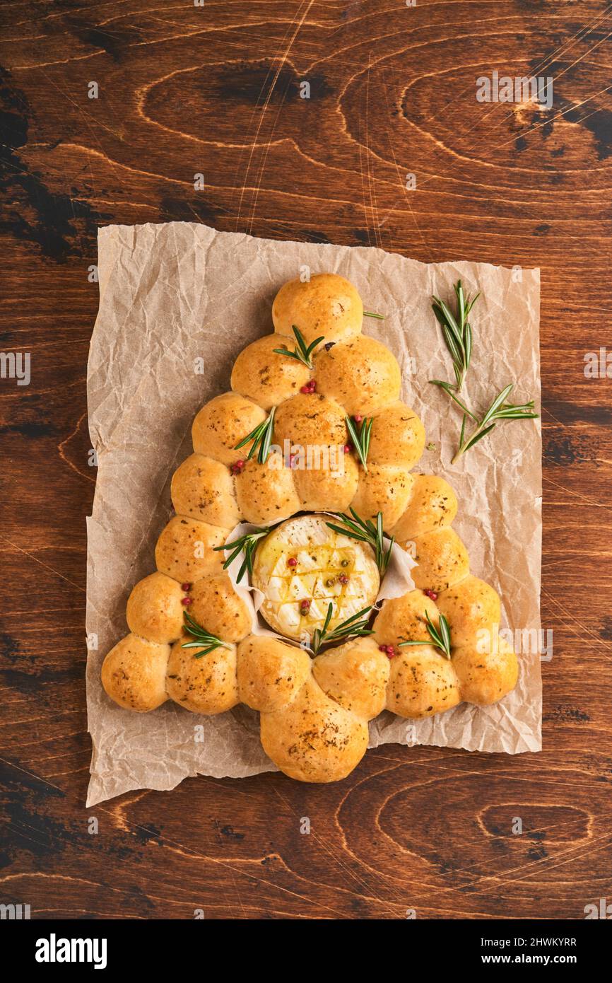Bread buns Christmas tree with Roasted camembert cheese and rosemary on ...