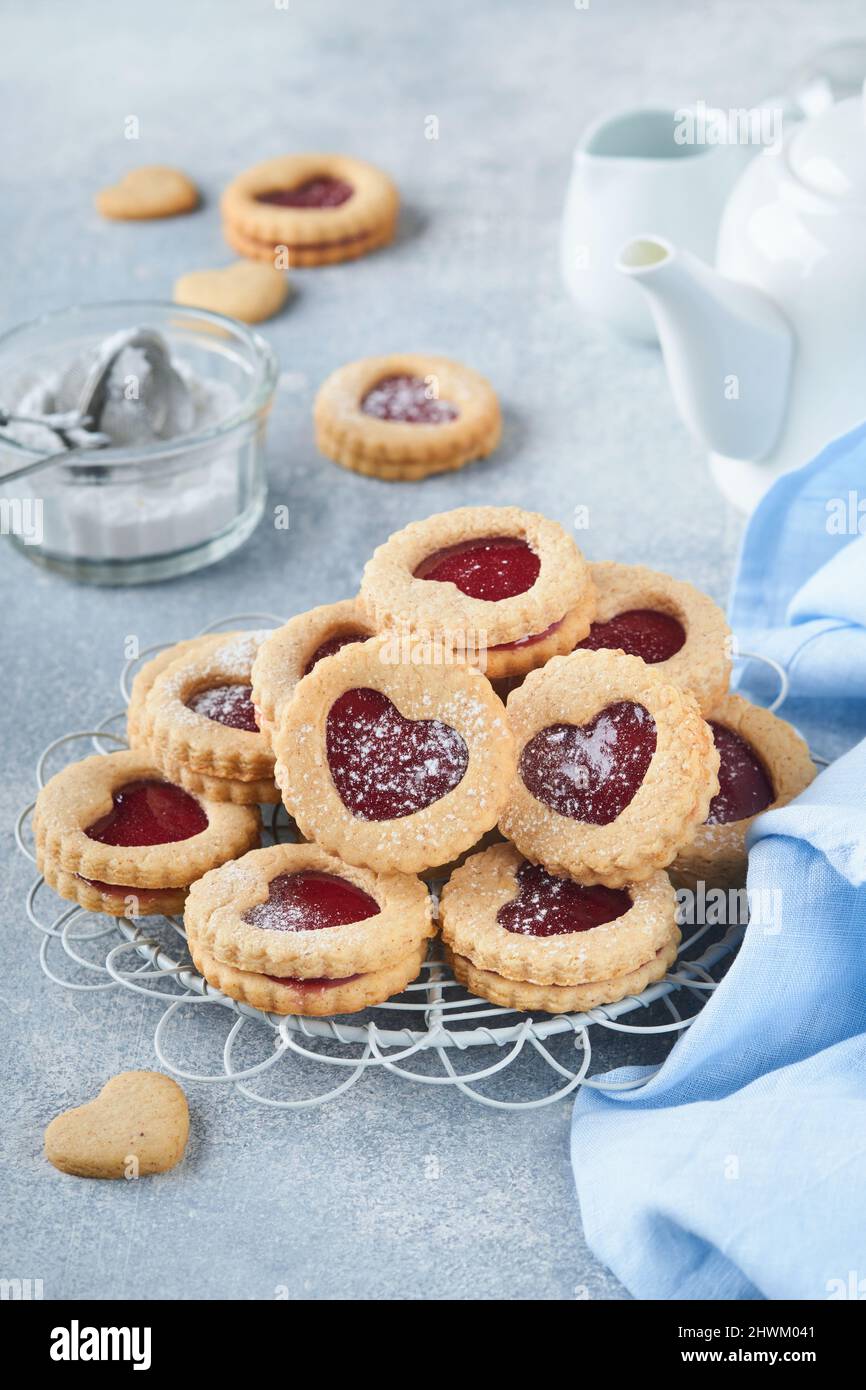 Traditional Linzer cookie with strawberry jam and powder sugar on light ...