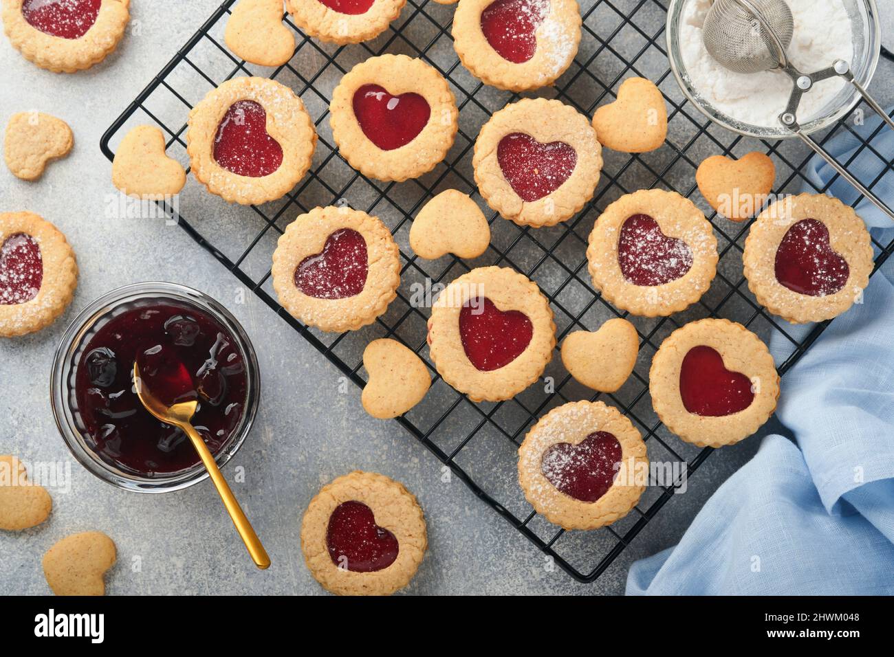 Traditional Linzer cookie with strawberry jam and powder sugar on light ...