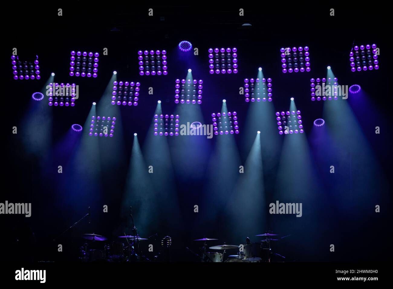 Dimmed stage overhead lights to illuminate musical concerts Stock Photo ...