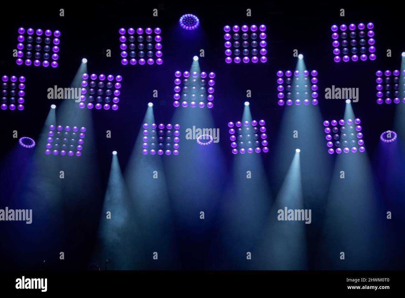 Dimmed stage overhead lights to illuminate musical concerts Stock Photo ...