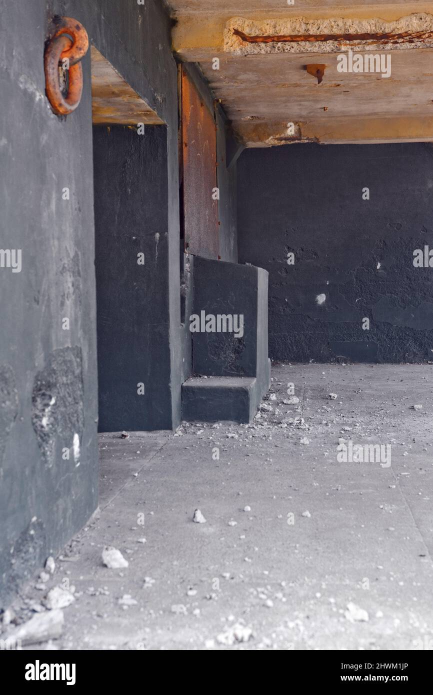 abandoned building with black rusty concrete walls Stock Photo - Alamy