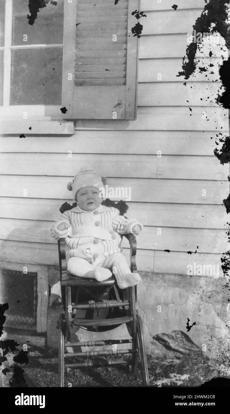 Toddler crying in a high chair Stock Photo - Alamy